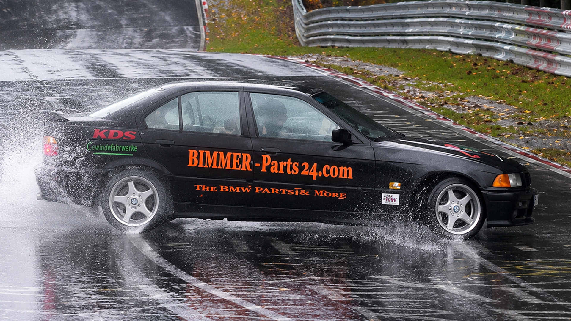 Driver fights for control during dangerous rainy track session