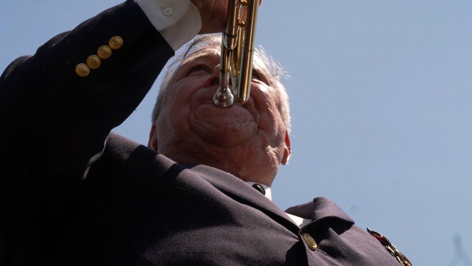 Air Force band veteran honors fallen with bugler call of 'Taps'