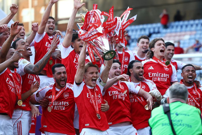 Soccer-West Ham relegated, Arsenal lift Premier League trophy on ...