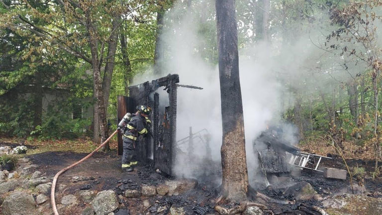 Sebago shed fire scorches nearby woods