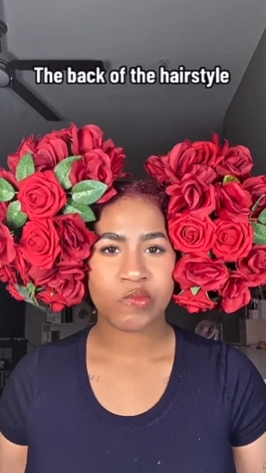Afro hairstyle with flowers back view reveal