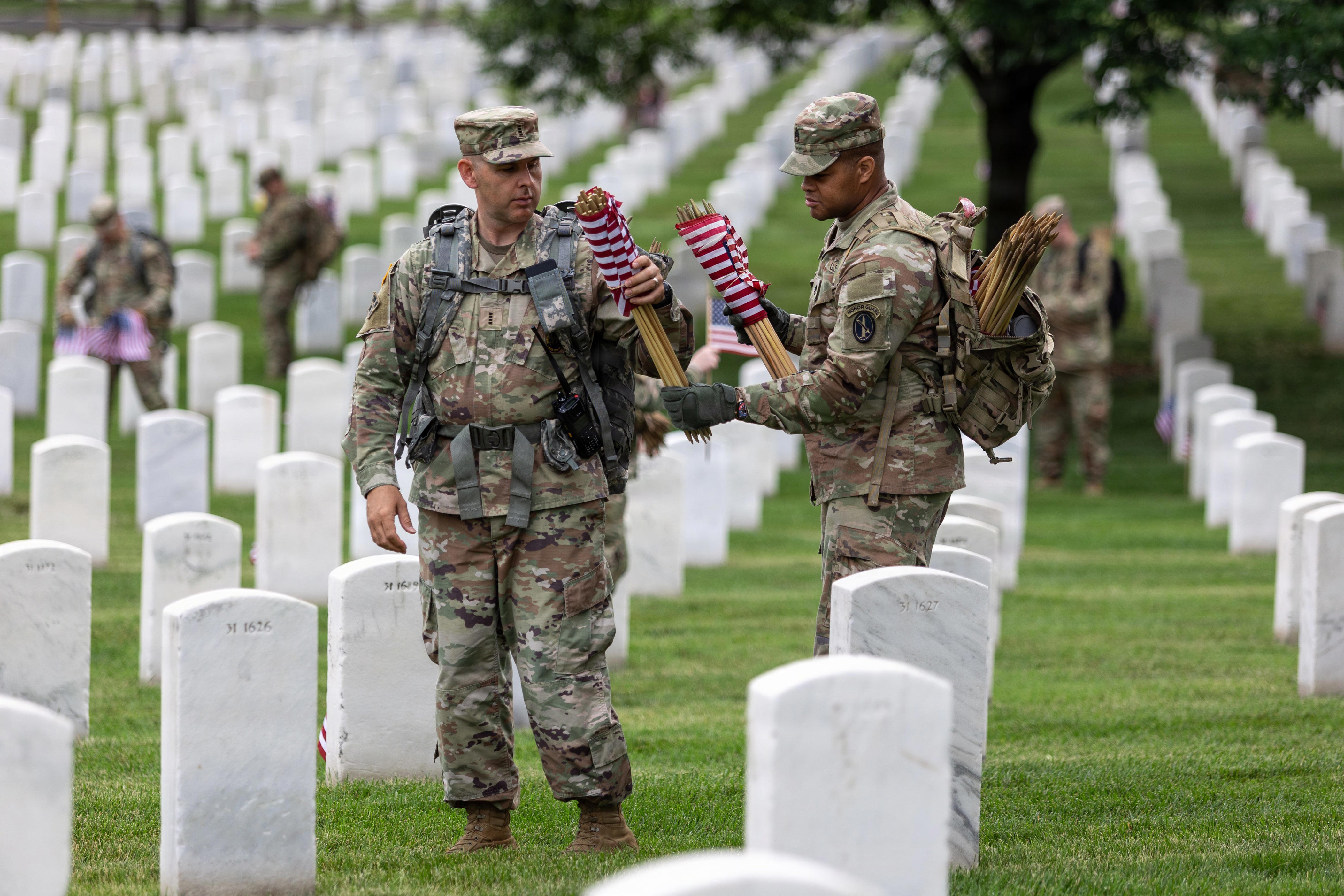 Army's Old Guard places flags at Arlington National Cemetery
