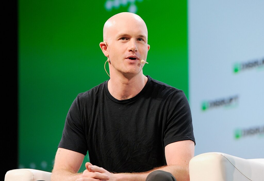 Coinbase to cut 700 jobs as CEO Brian Armstrong pushes AI 'one-person ...