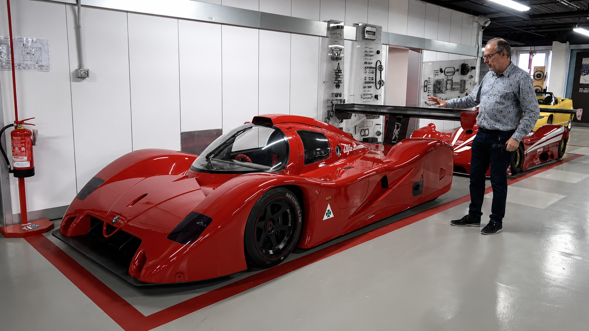 A historical race car inside Alfa Romeo Museum in Italy