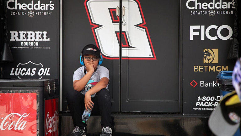 Kyle Busch's family surrounded by drivers and team owners during ...