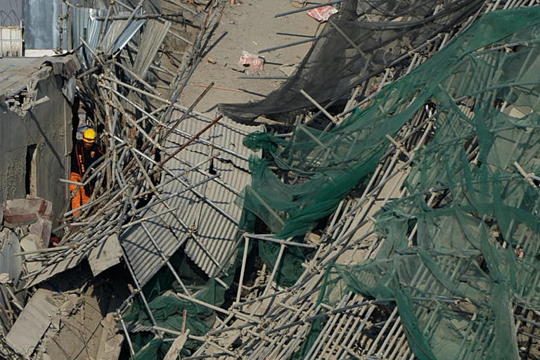 At least four dead, 17 still missing after collapse of unfinished hotel ...