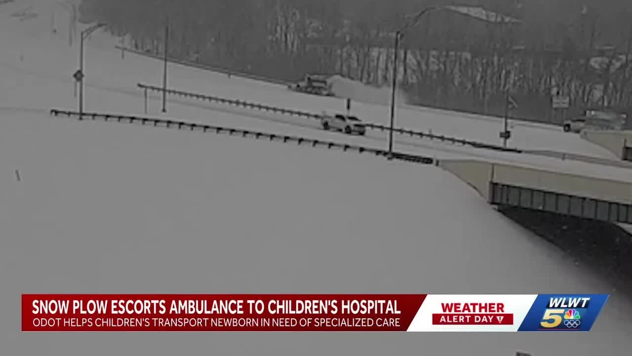 Snow plow escorts ambulance during winter storm in Cincinnati