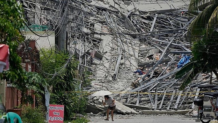 At least four dead, 17 still missing after collapse of unfinished hotel ...
