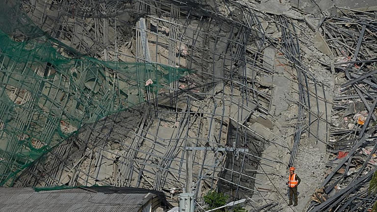 At least four dead, 17 still missing after collapse of unfinished hotel ...