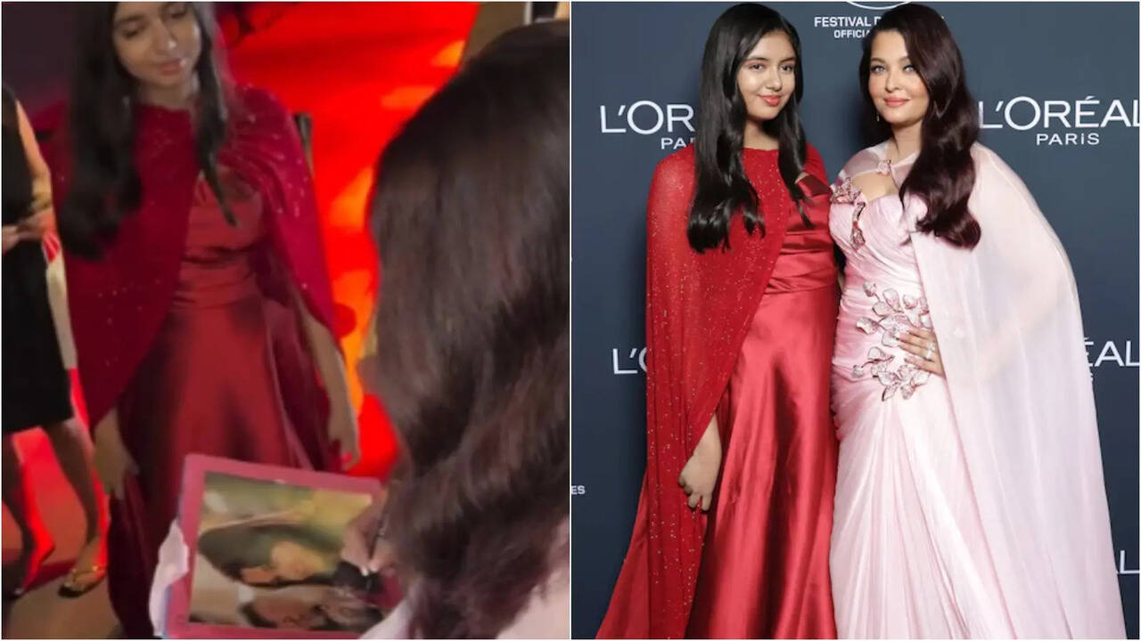 Aaradhya Bachchan looks dotingly at mum Aishwarya Rai as she signs ...