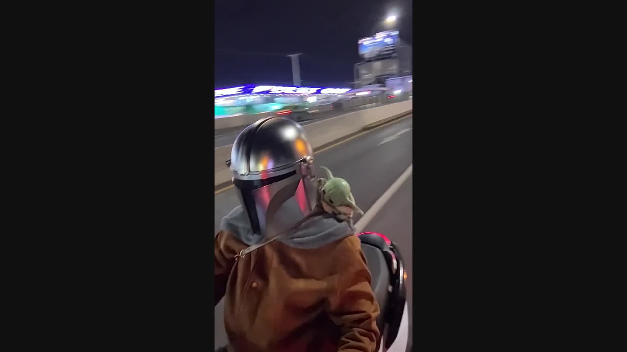 Star Wars fan rides motorcycle with Mandalorian helmet and Grogu on ...