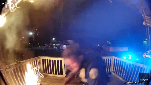 Hero police officer busts down door to save family from house fire