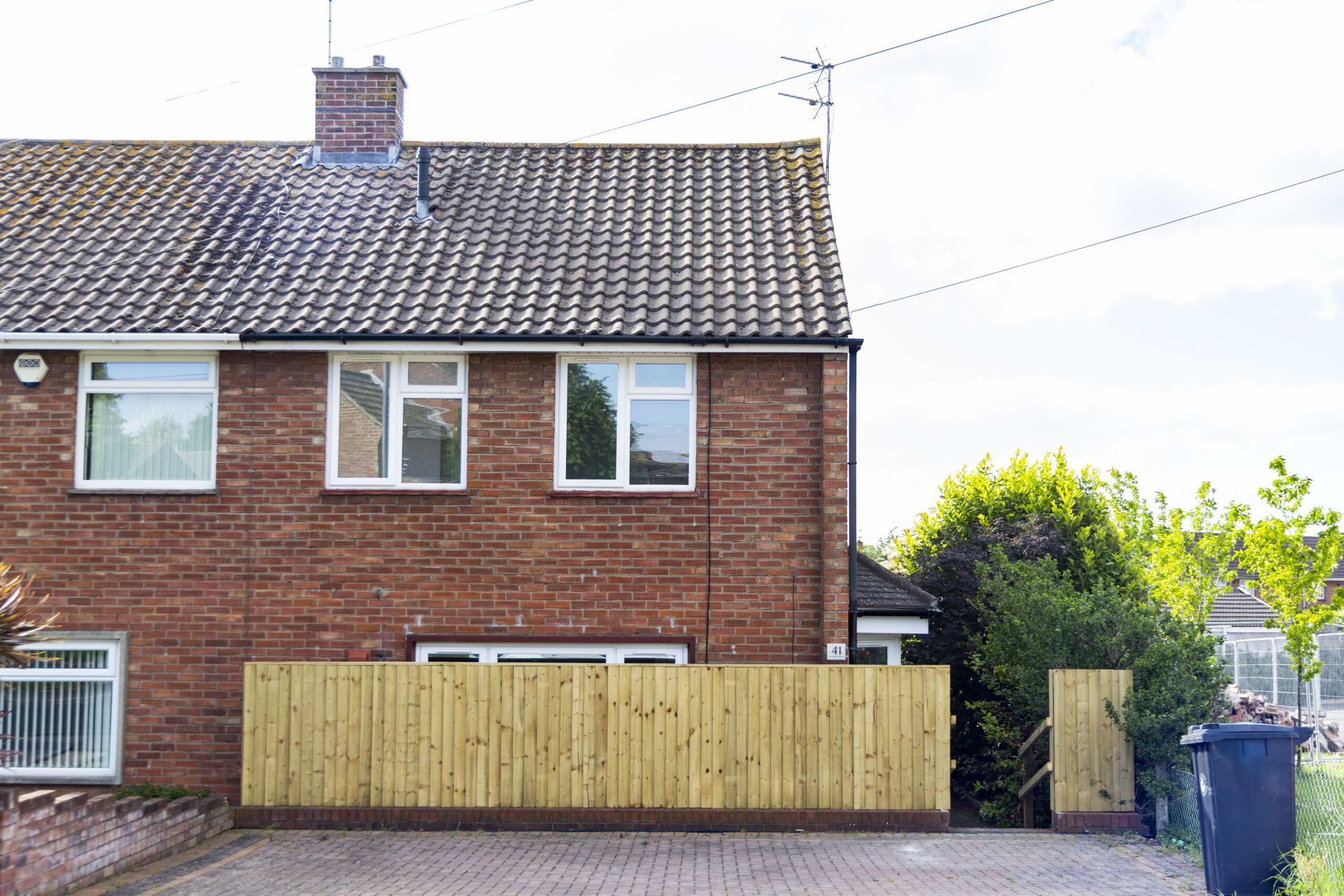 Neighbours baffled after garden fence installed across living room window