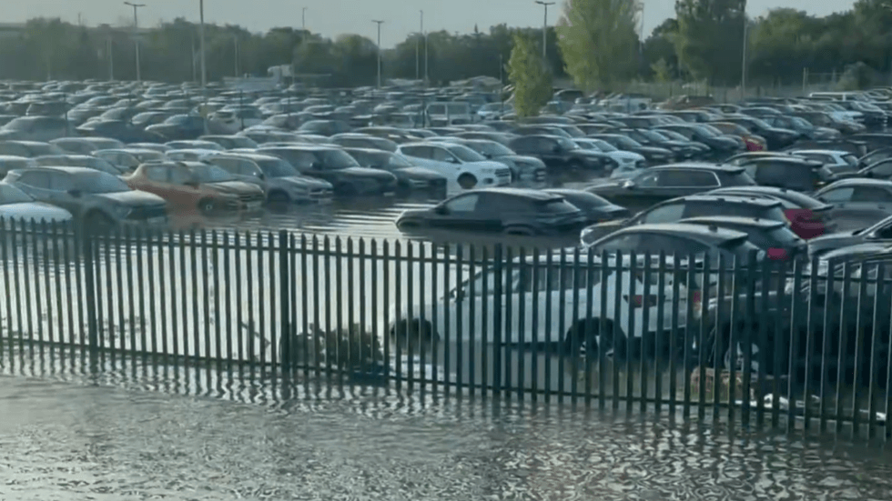 Britons returning from holiday devastated after airport car park floods ...