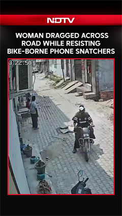 On camera: Woman dragged across road while resisting bike-borne snatchers
