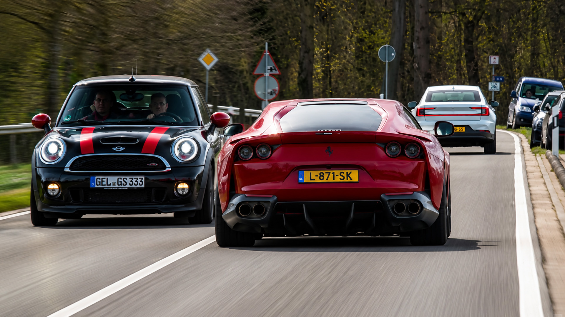 Ferrari 812 has a close call with Mini Cooper on narrow road