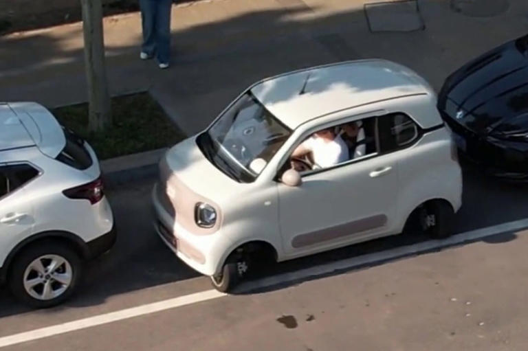 Tiny EV slides sideways into tight parking space