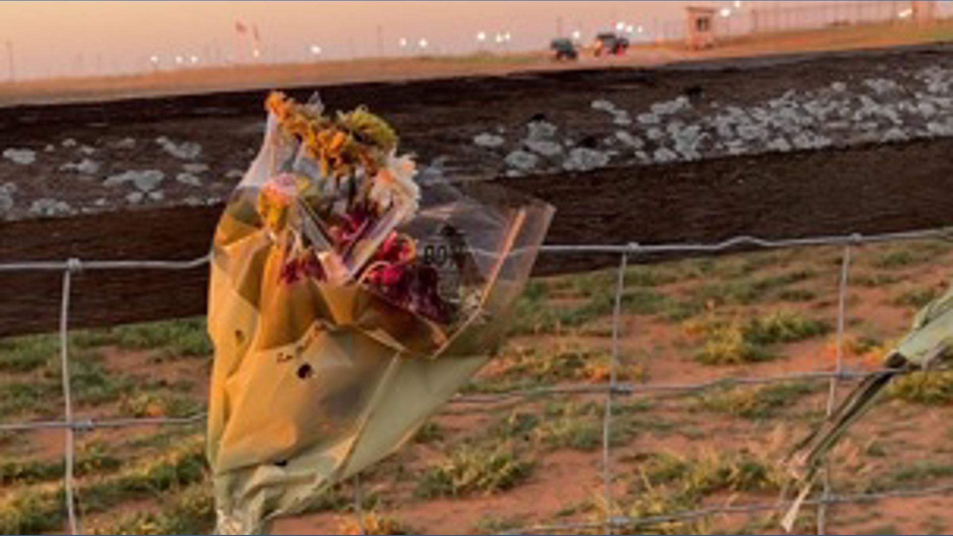 Flowers at the Dilley ICE detention center fence