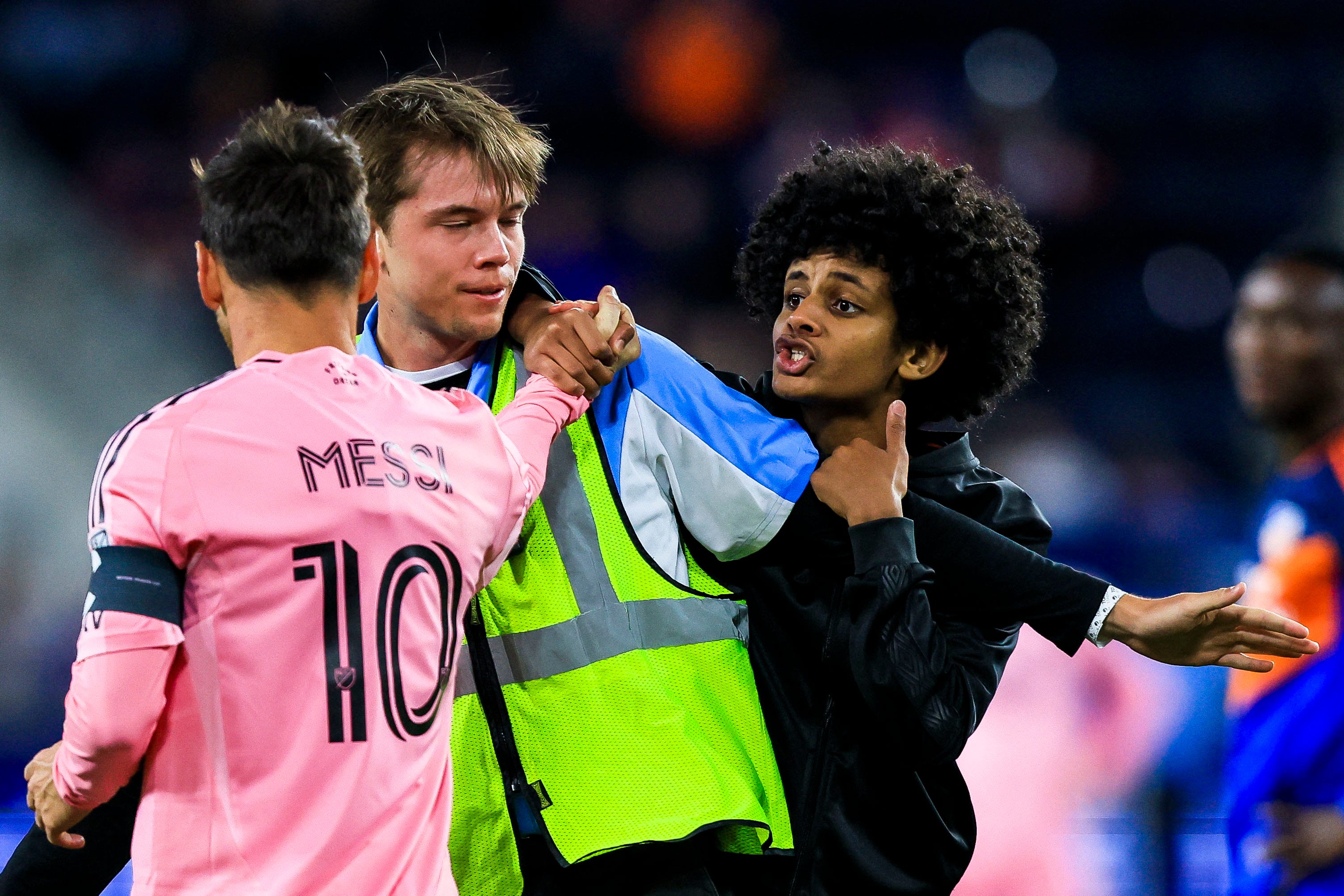 Security shields Lionel Messi from fan during FC Cincinnati-Miami game