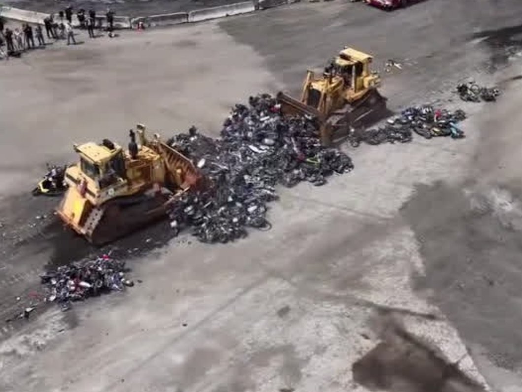 Police attacks scooters with bulldozers