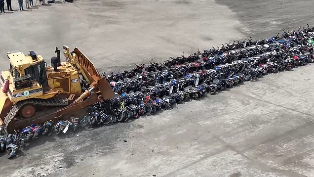New York cops crush illegal mopeds with huge bulldozers