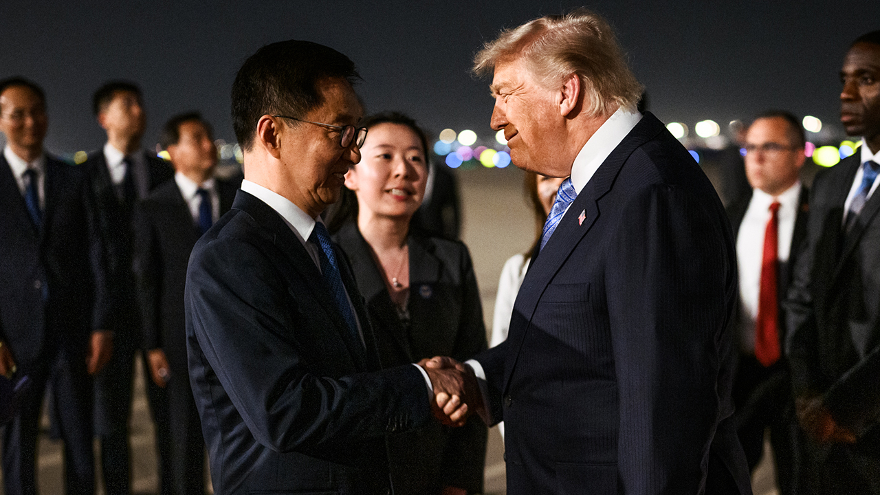 Trump lands in China with 12 high-profile business leaders