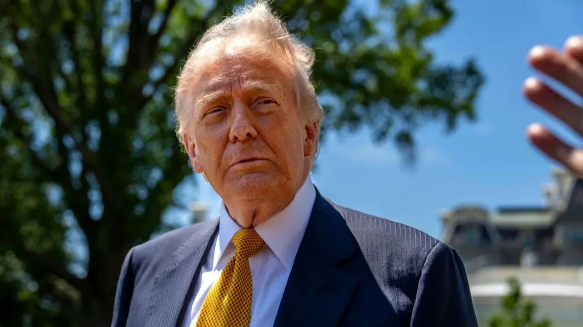 Donald Trump’s receding hairline exposed during windy departure to China