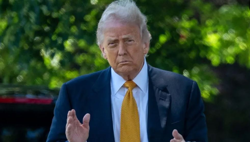 Donald Trump’s receding hairline exposed during windy departure to China