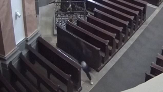 Moment hooded thief steals 800-year-old skull from Czech church