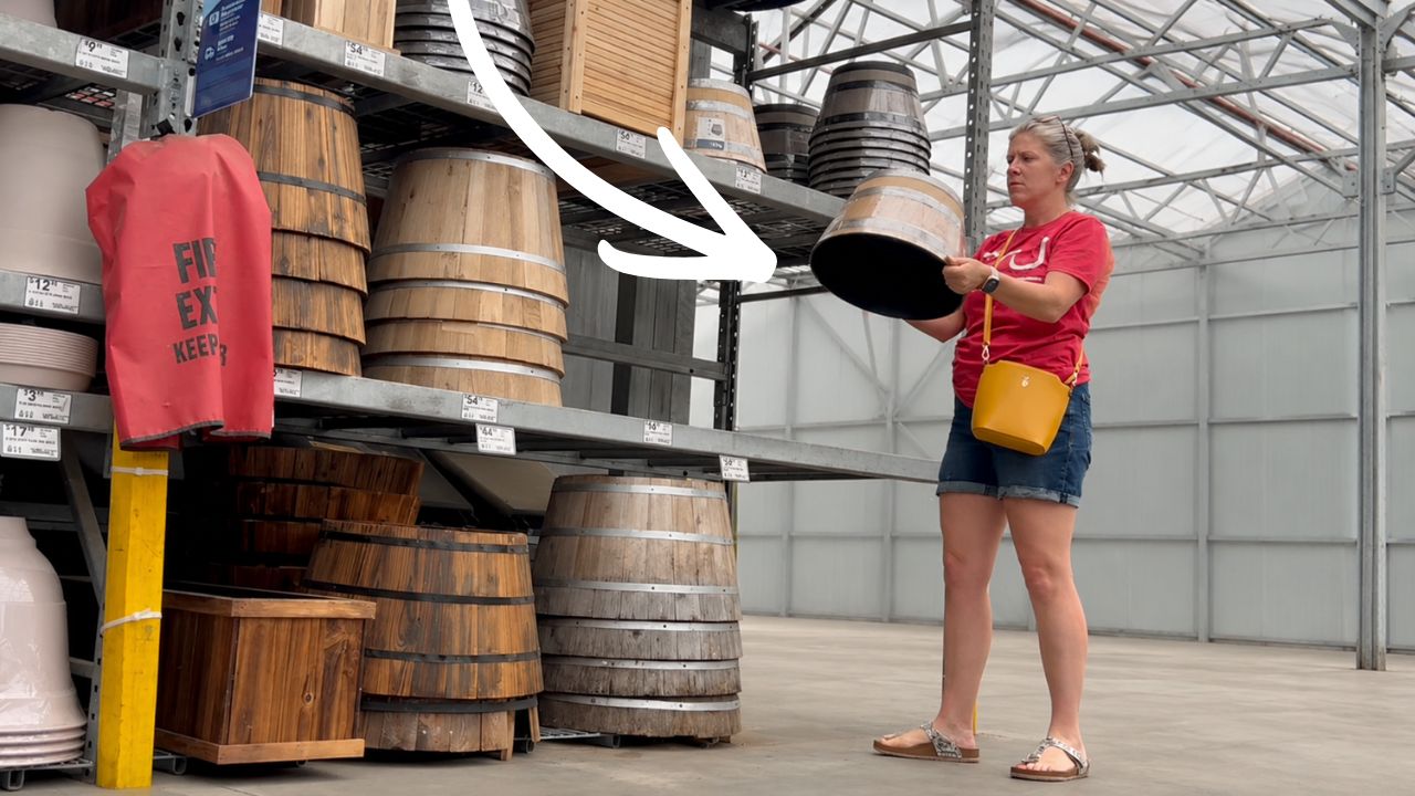 She turns a Walmart barrel into a garden masterpiece!