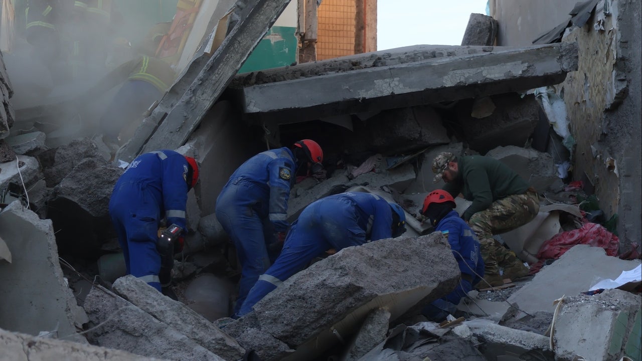 Ukrainians buried under rubble after deadly Russian strike
