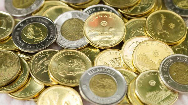 Canada's new coin is a red, orange and white loonie and you can find it ...