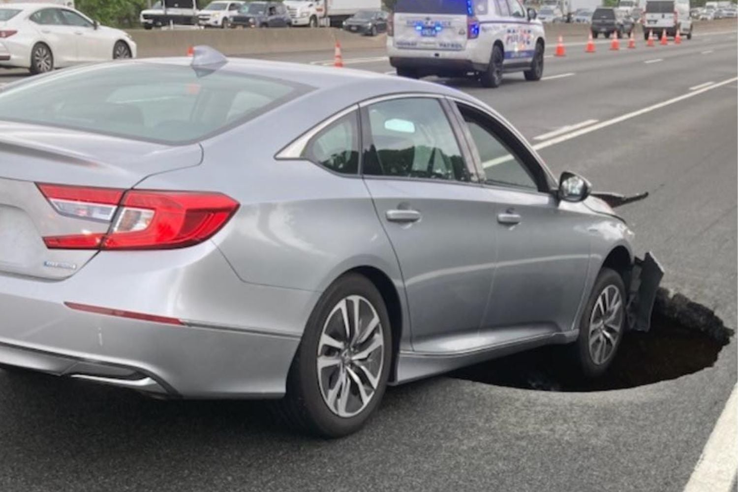 Watch: Massive sinkhole suddenly swallows car on LIE in Melville