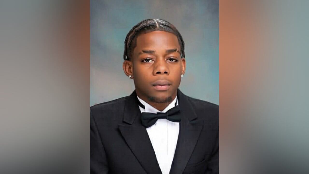 Mom accepts diploma for son recovering from mass shooting