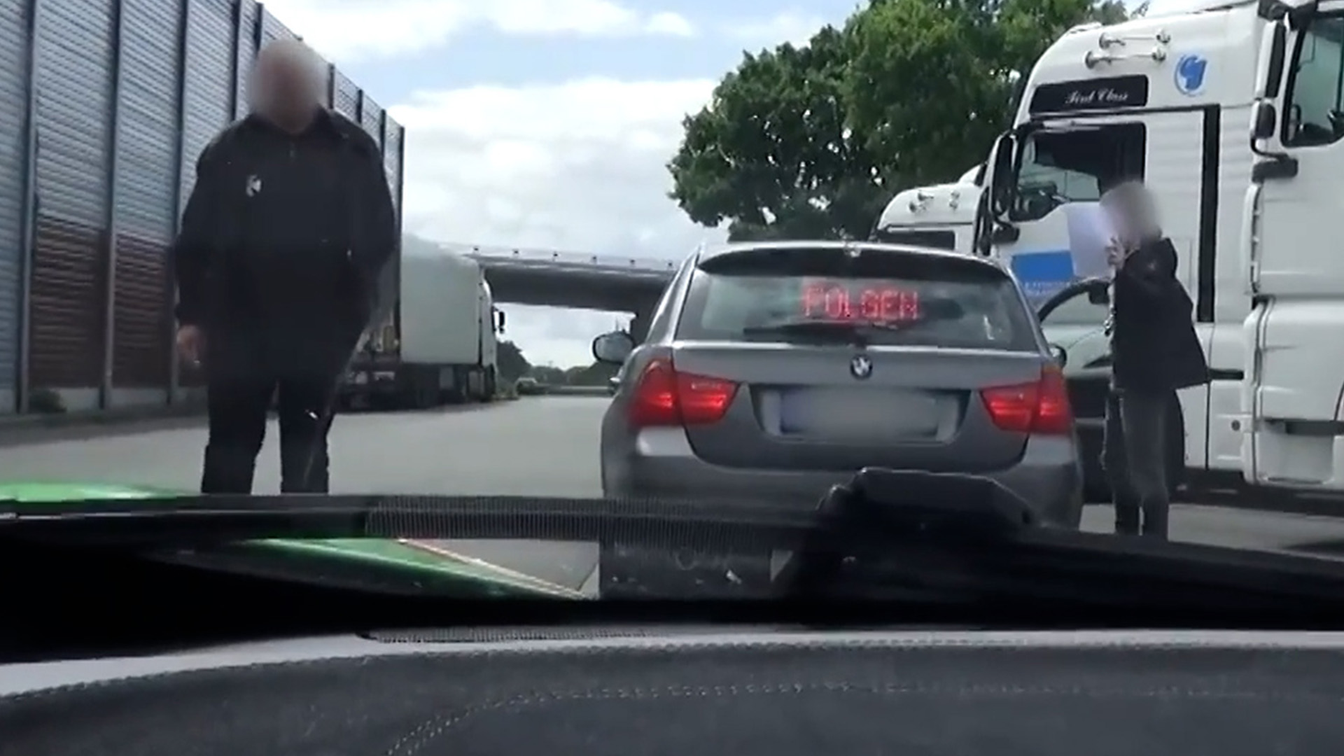 German traffic stop scene with BMW wagon on European highway