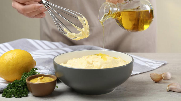 A slather of mayonnaise will make your garlic bread extra savory