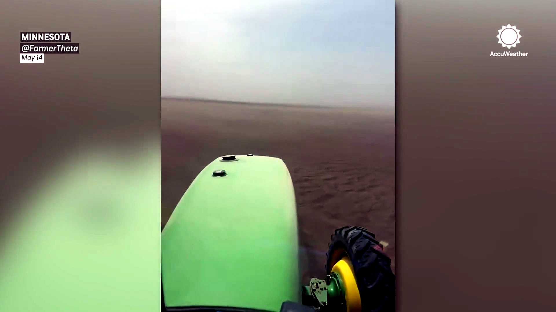 Blowing dust sweeps across fields and roads from Minnesota into Canada