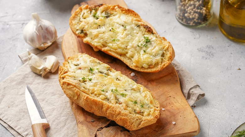 A slather of mayonnaise will make your garlic bread extra savory