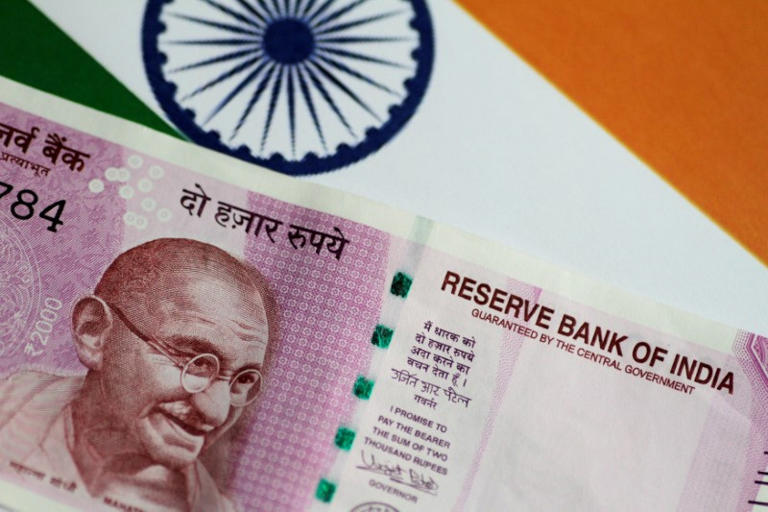 Oil price strain keeps rupee near record low, state banks' dollar sales ...