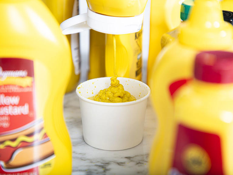 We taste-tested 15 yellow mustards—these are the 3 going on our hot dogs