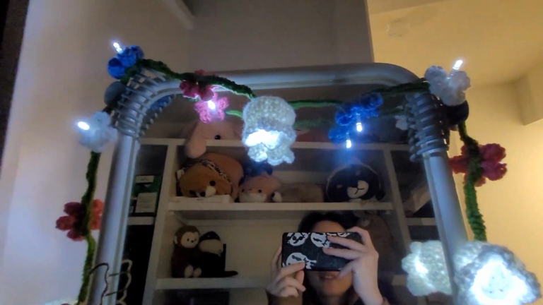 Crochet plants and flower lights turn a craft table into a handmade garden