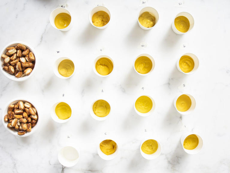 We taste-tested 15 yellow mustards—these are the 3 going on our hot dogs