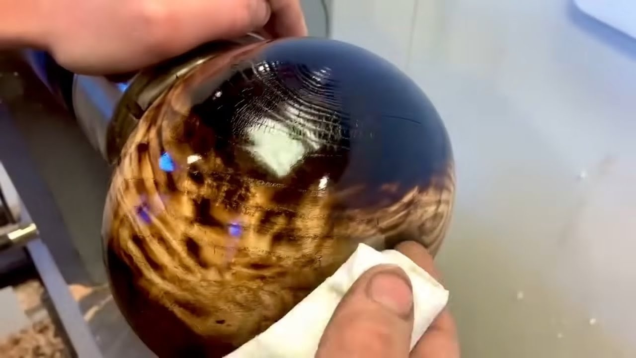 Watch this dark wood blank slowly become a decorative bowl