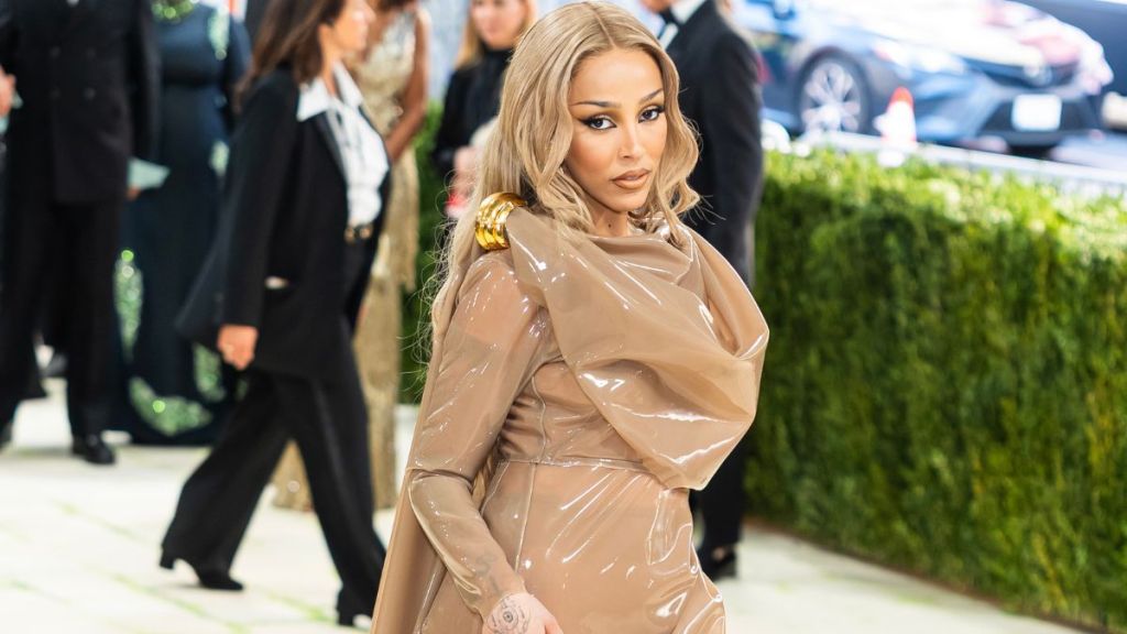 Doja Cat boldly leaves Balenciaga shirt unbuttoned for plunging look