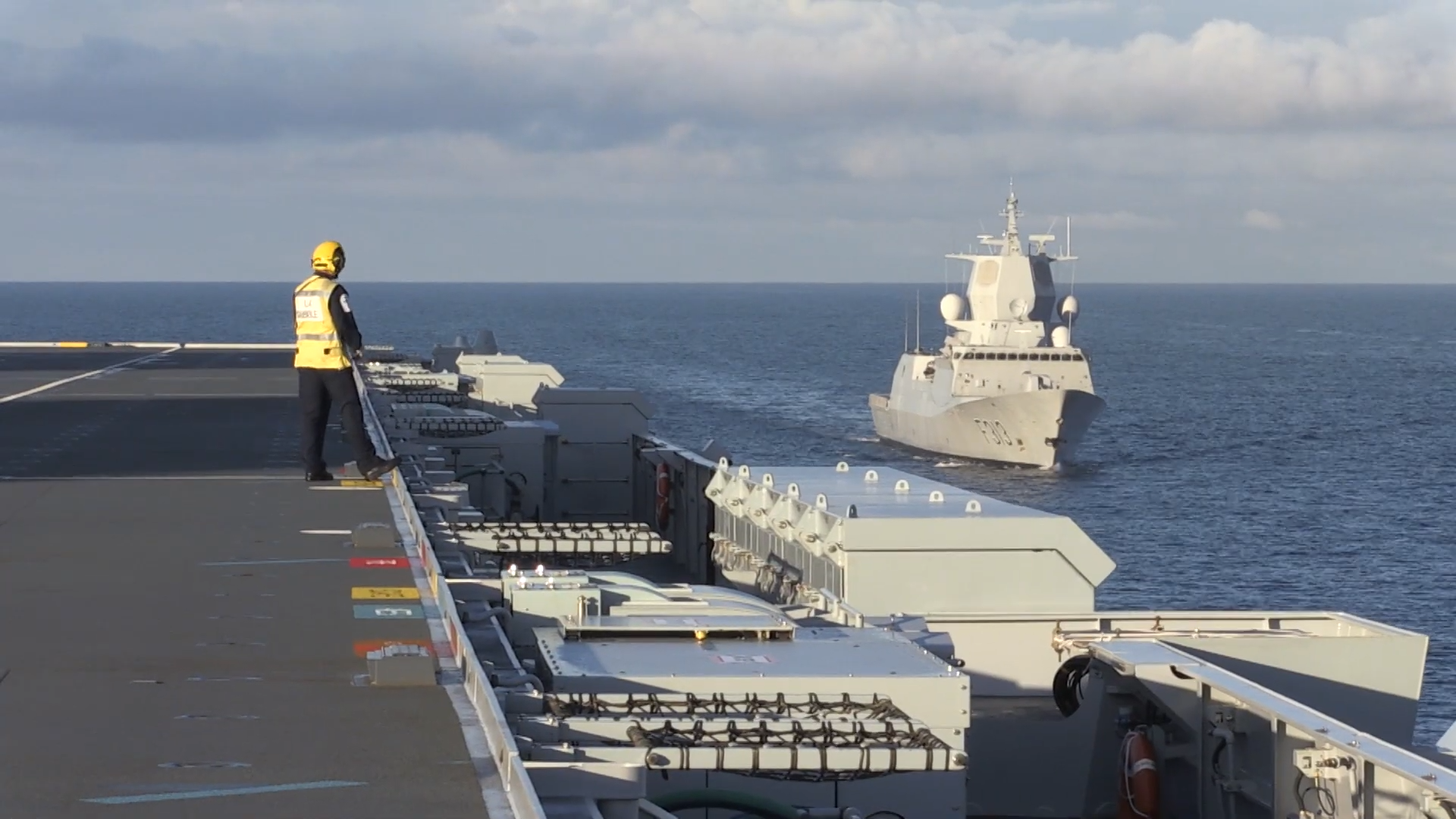Two carrier strike groups operate side by side at sea