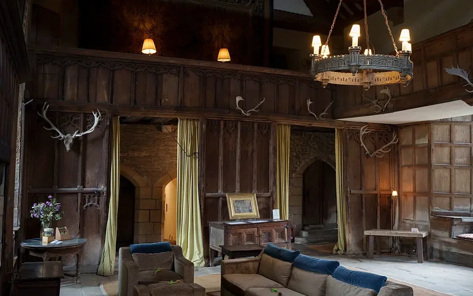 Designers merge medieval accents with mid-century warmth