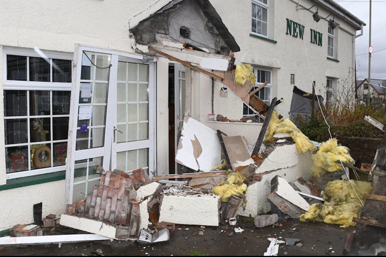 Man ploughs stolen bulldozer into village pub after taunts