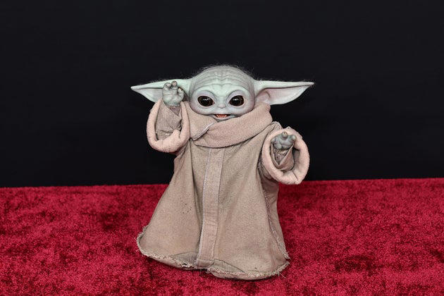 Grogu striking a pose on The Mandalorian movie premiere red carpet is ...