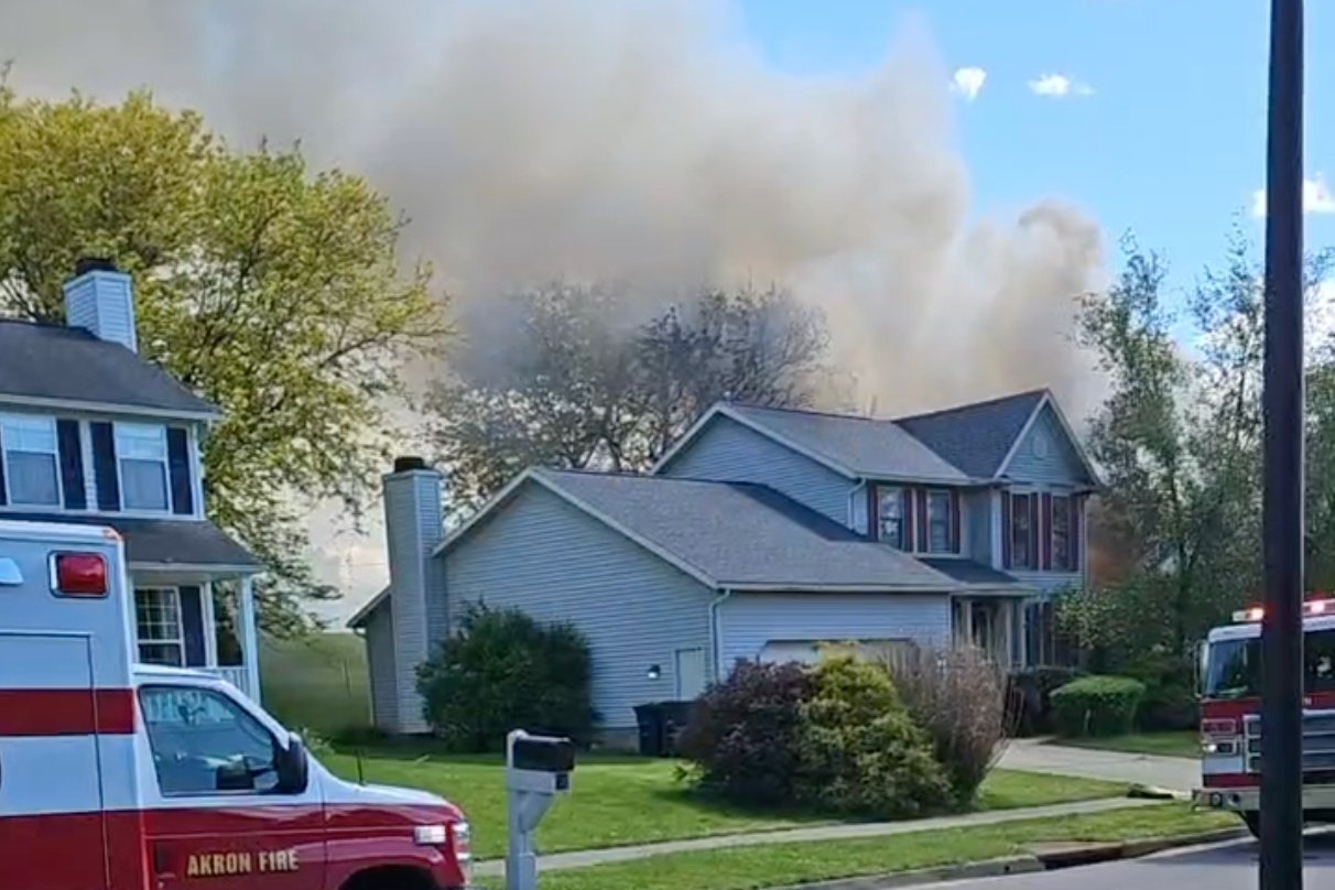 Two killed after plane crashes into house with family inside