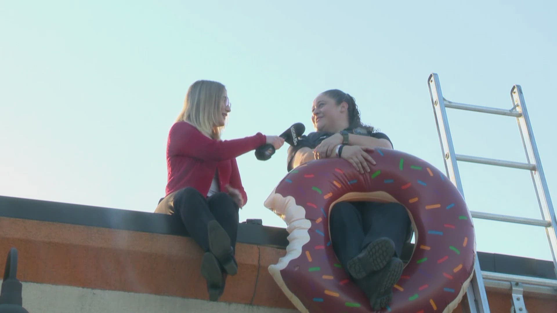 Local 5 speaks with a cop on a rooftop